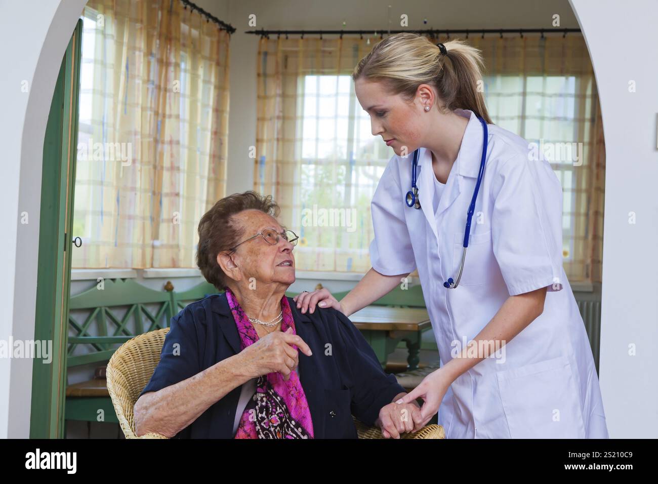 The doctor visits a sick old lady. Home visit and ward round Austria ...