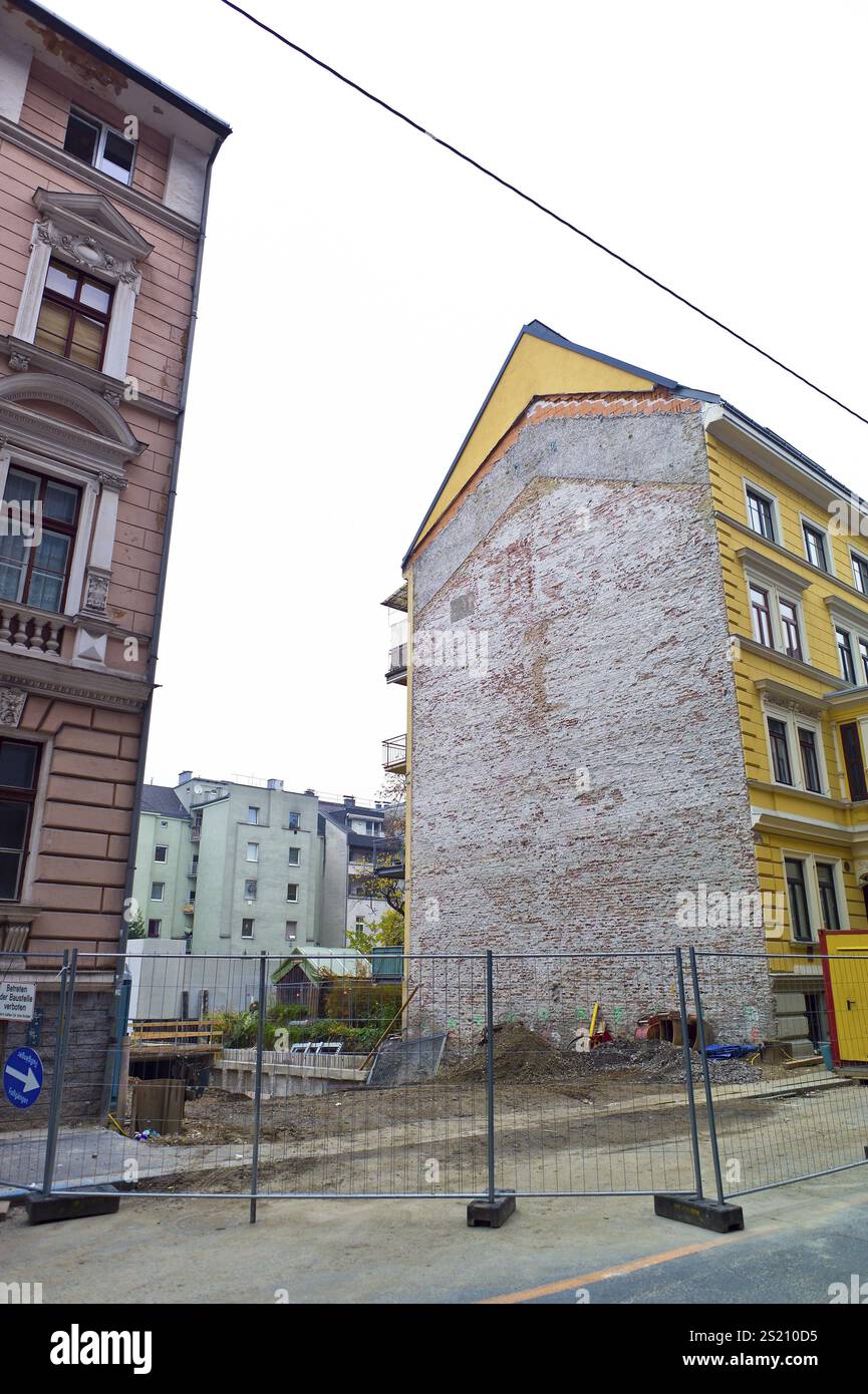 A gap between two houses in a town. Austria Stock Photo - Alamy