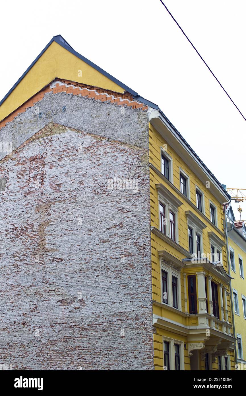A gap between two houses in a town. Austria Stock Photo - Alamy