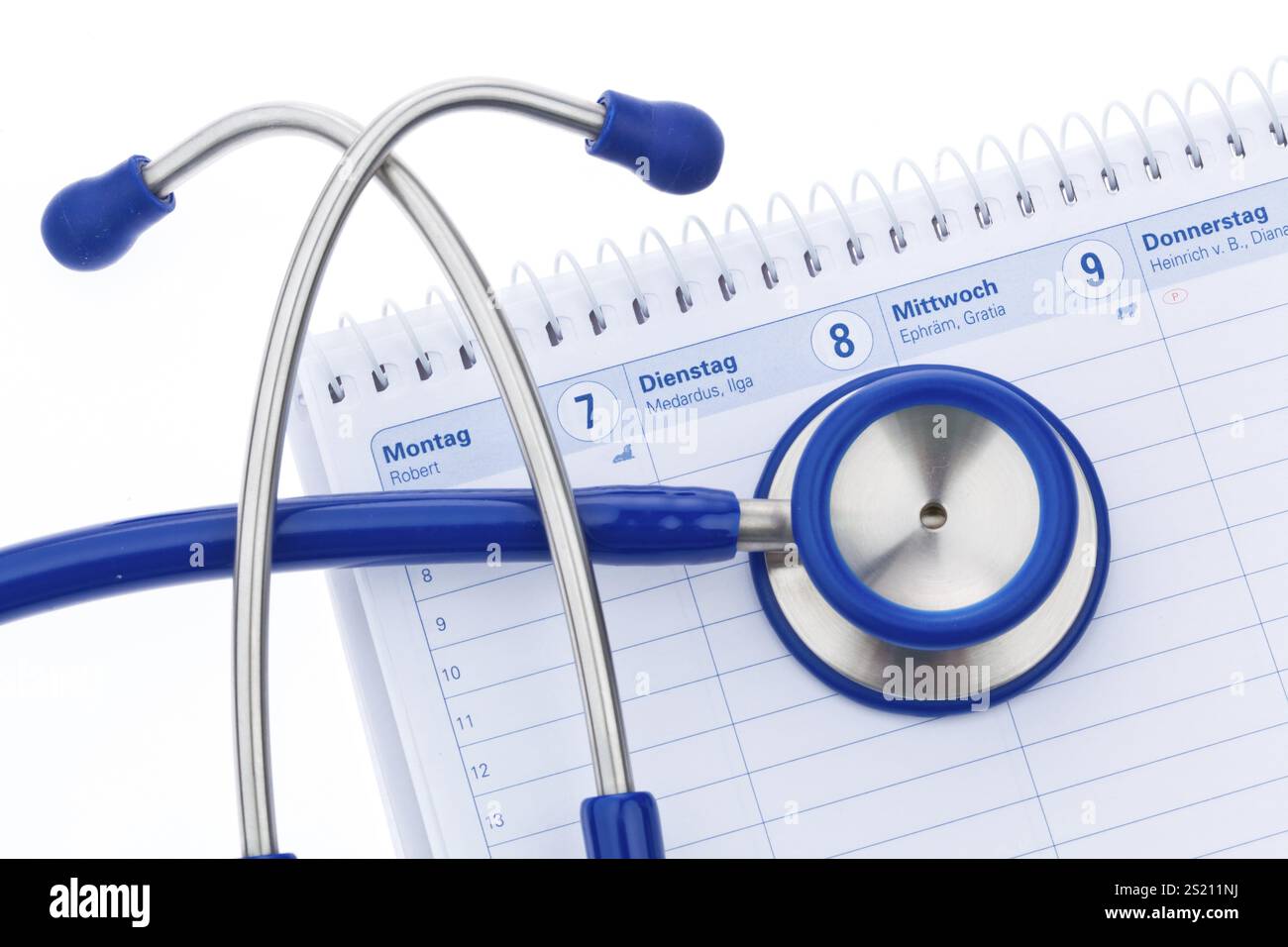A stethoscope lies on a calendar. Working hours of a doctor Austria ...