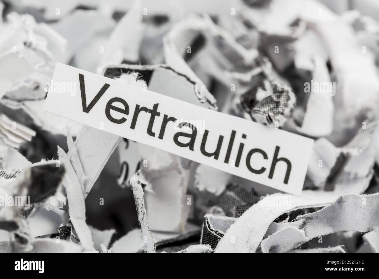 Paper shreds with the keyword Confidential, symbolic photo for data ...