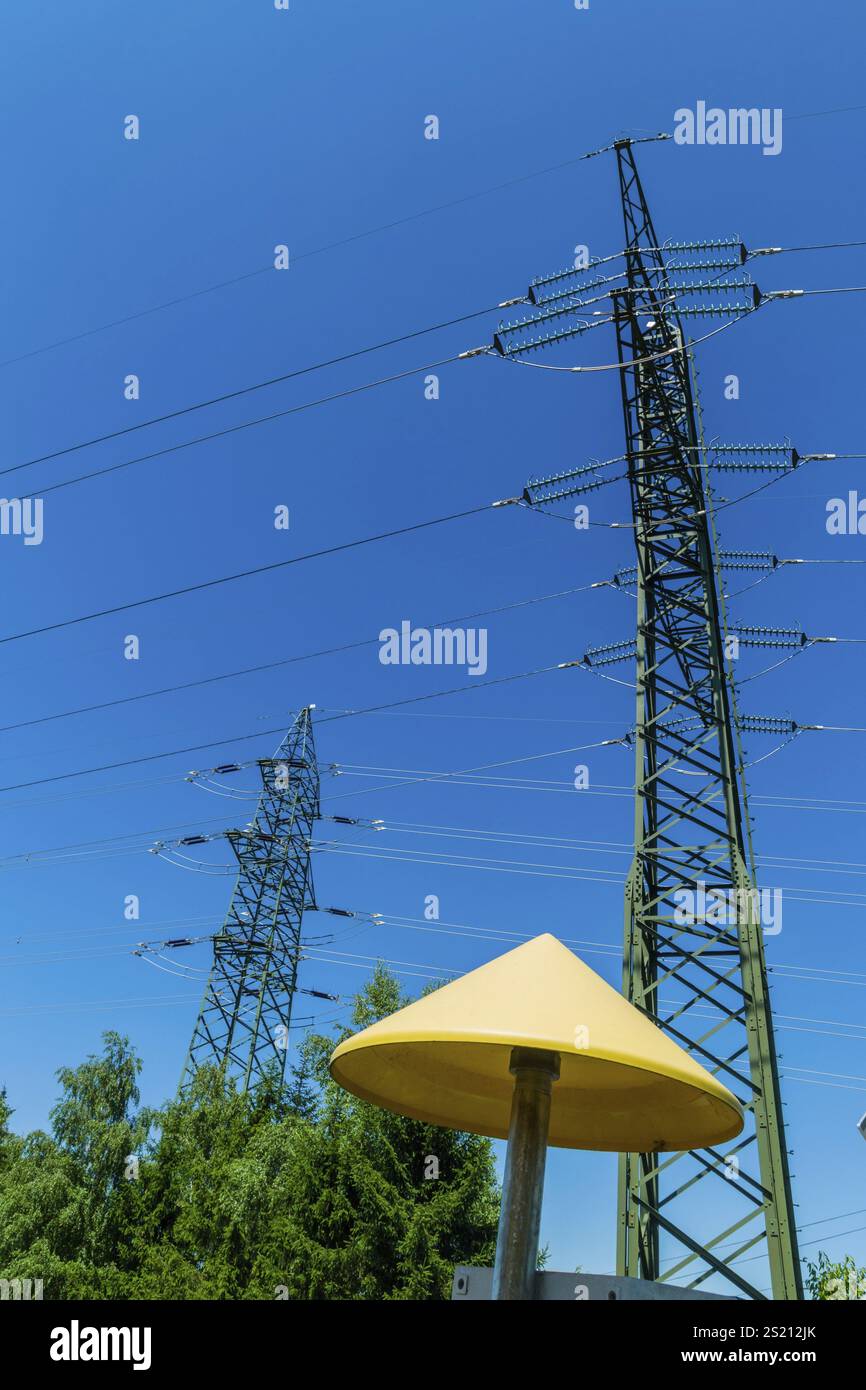 A gas pipeline and an electricity pylon of a high-voltage power line ...