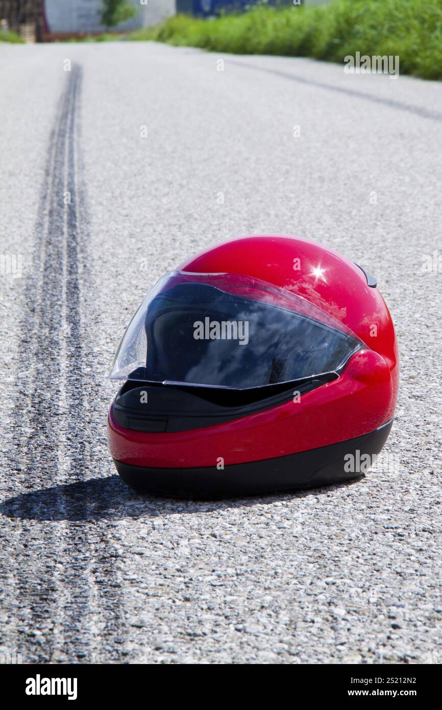 An accident with a motorbike. Traffic accident and skid marks on road ...