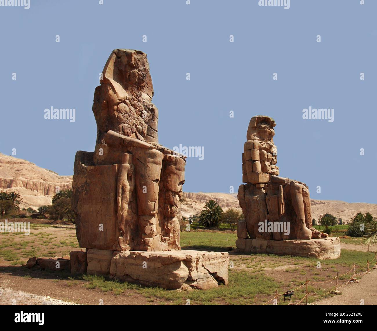 Stone monuments Collosi of Memnon in Egypt Stock Photo - Alamy