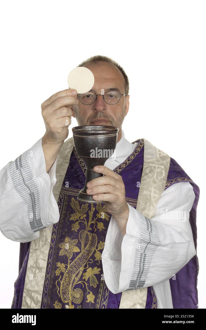 A Catholic priest taking communion at a church service Austria Stock ...