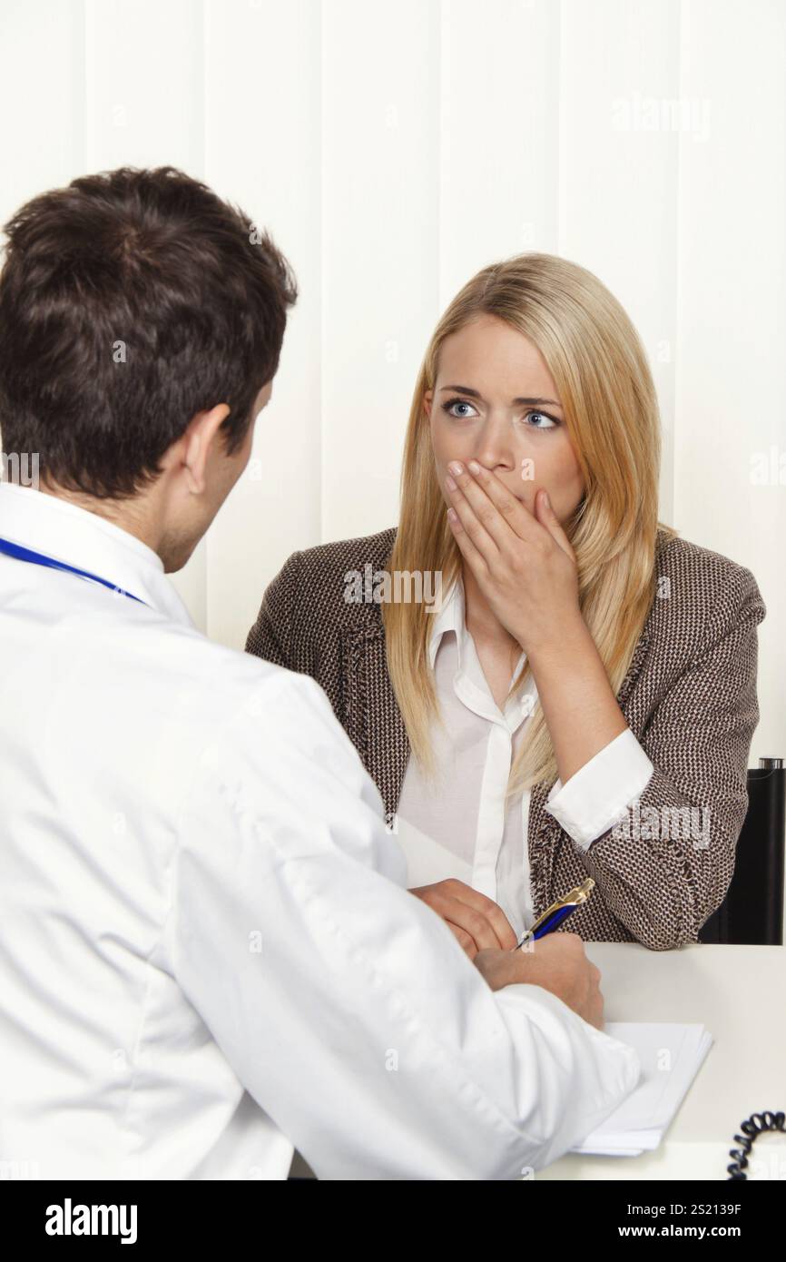 Conversation with a doctor. Patient and doctor talking in a doctor's ...