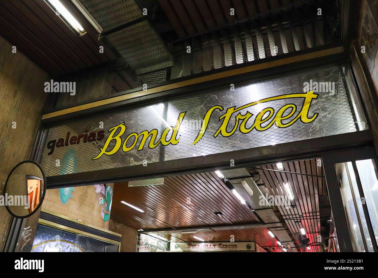 Side entrance sign to the traditional Bond Street gallery at night ...
