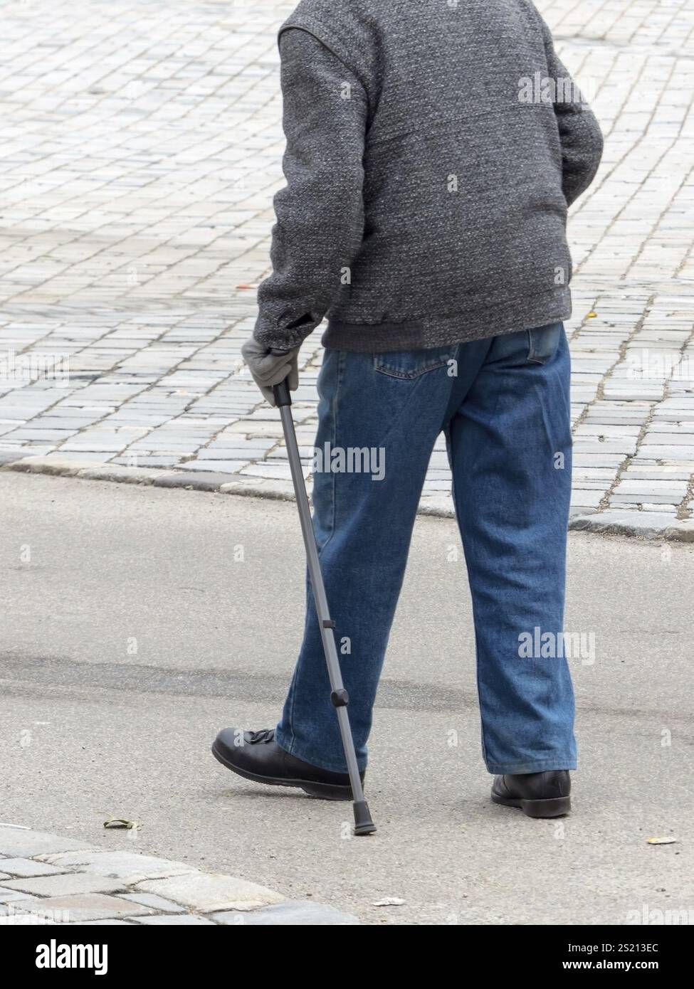 A man with a walking stick to help with a walking disability Austria ...