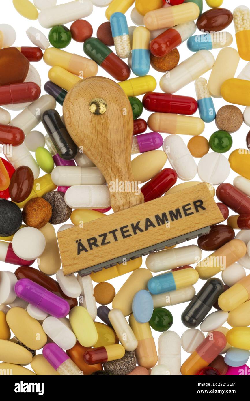 Stamp on colourful tablets, symbolic photo for the Austrian Medical ...