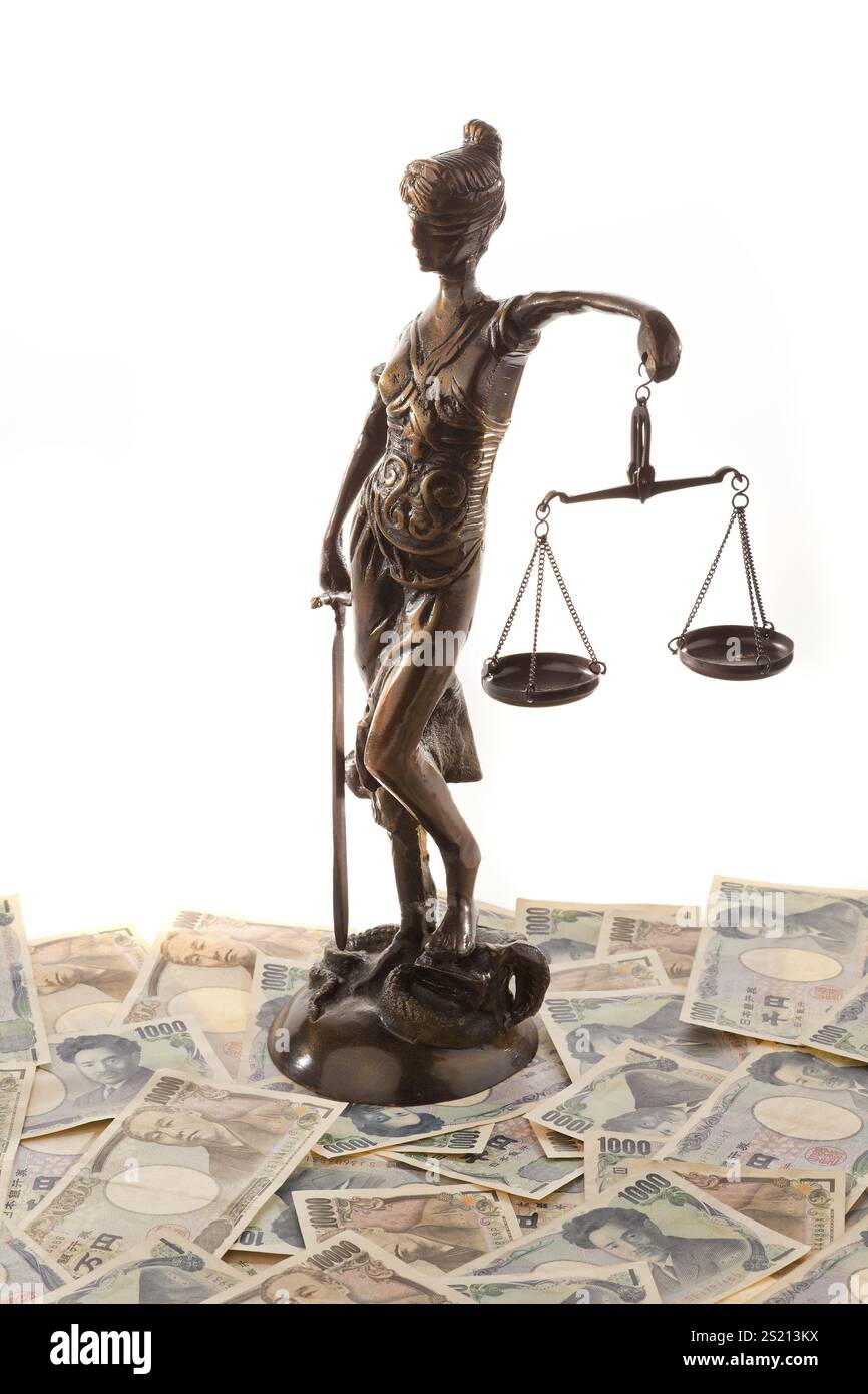 Justitia with scales and yen. Symbol for justice Stock Photo - Alamy