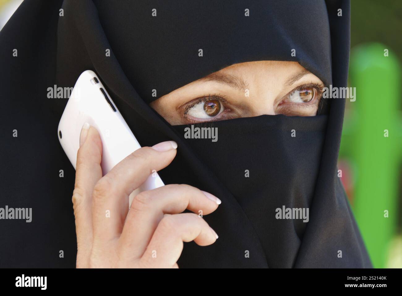 Symbolic photo Islam. Muslim woman with veils and burqas is on the ...