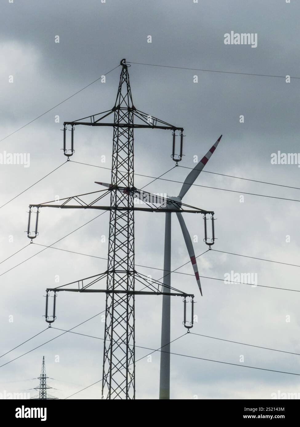 Wind turbines and electricity pylons in a wind farm. Wind power plant ...