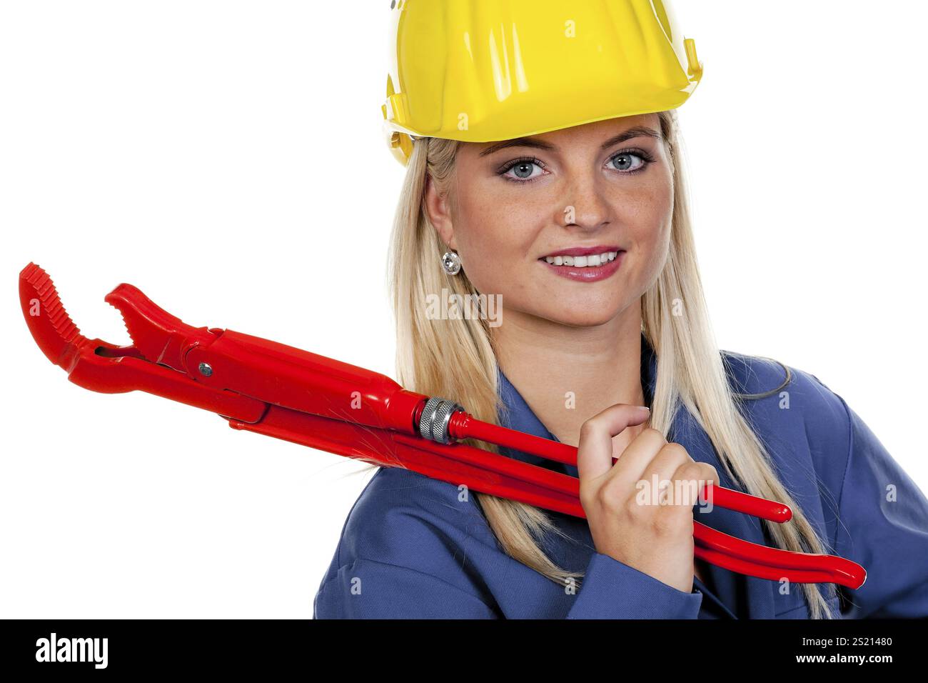 Young woman in blue work clothes with pipe wrench Stock Photo - Alamy
