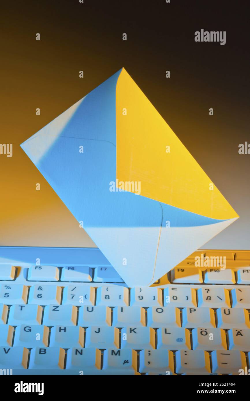 The keyboard of a computer and an envelope. Communication via e-mail ...