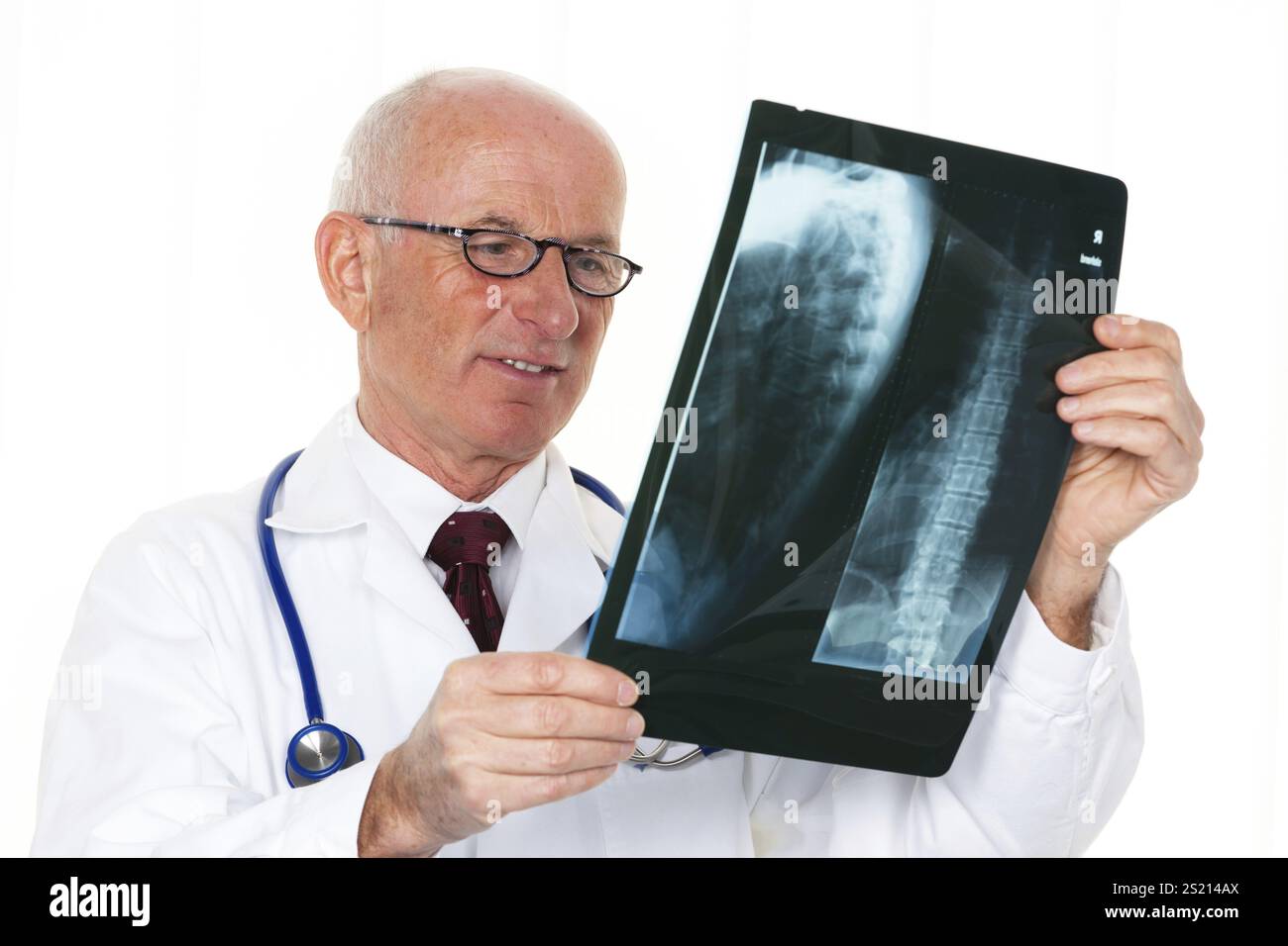 An X-ray doctor with an X-ray image in the doctor's surgery. Austria ...