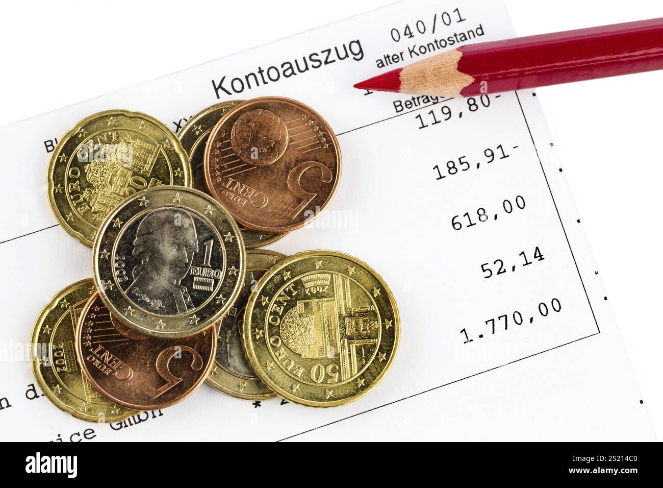 The bank statement of a bank and some coins of the euro currency ...