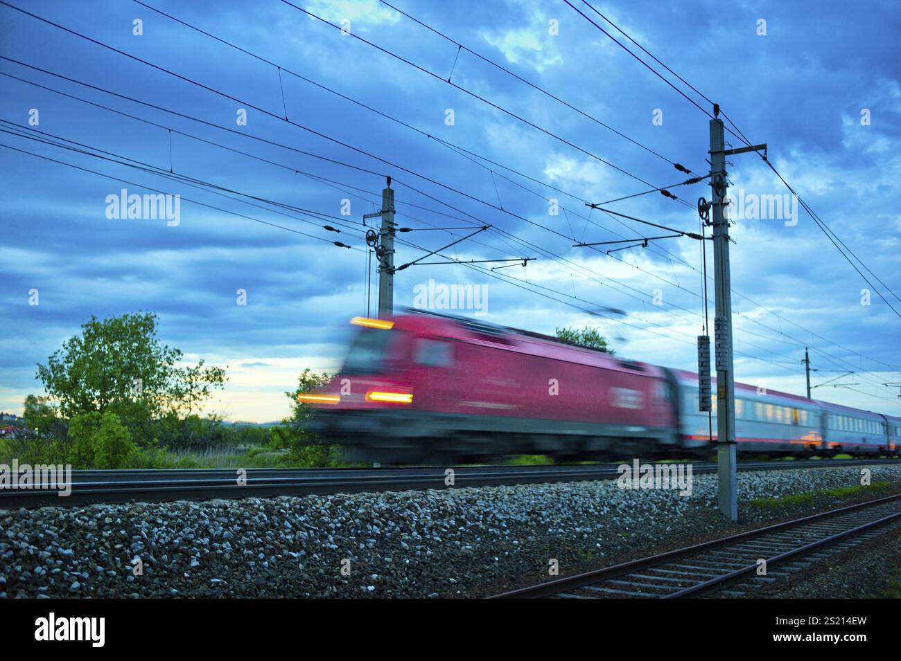 A passenger train travelling through the night. Night train with OeBB ...