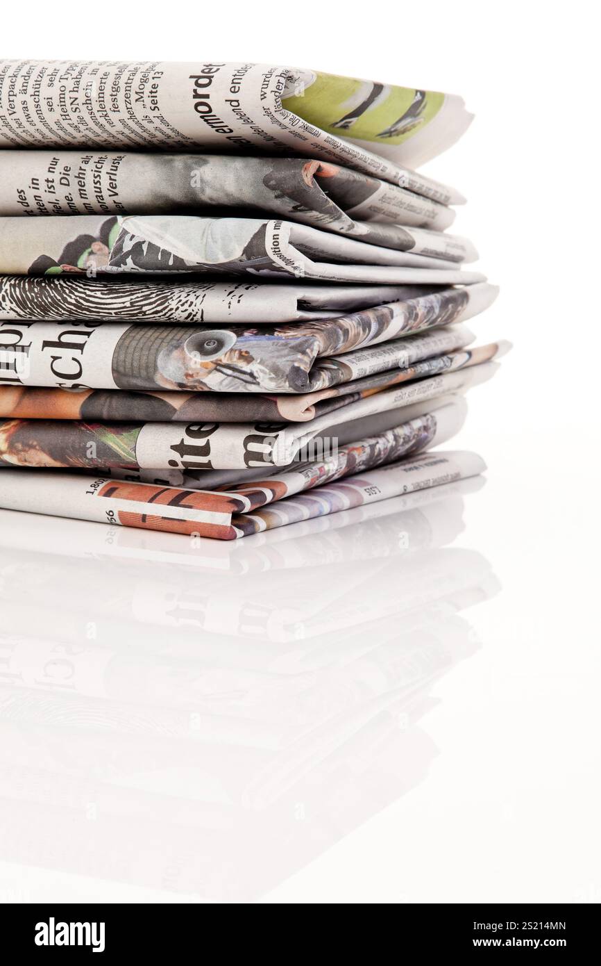 Old newspapers and magazines in a pile Austria Stock Photo - Alamy