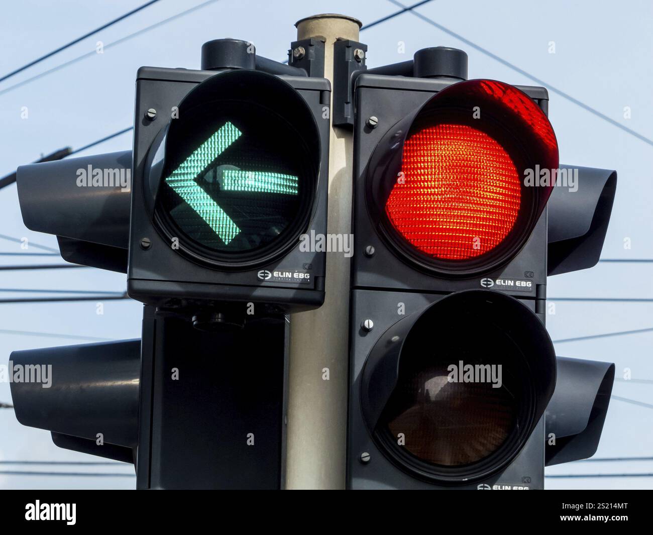 A traffic ramp with a red light. Green light for left turners. Austria ...
