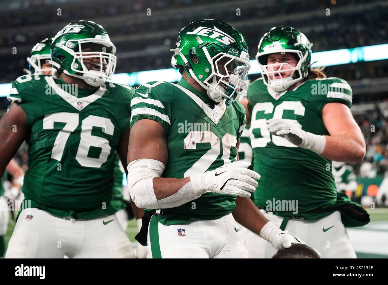 New York Jets running back Breece Hall, center, celebrates scoring a ...