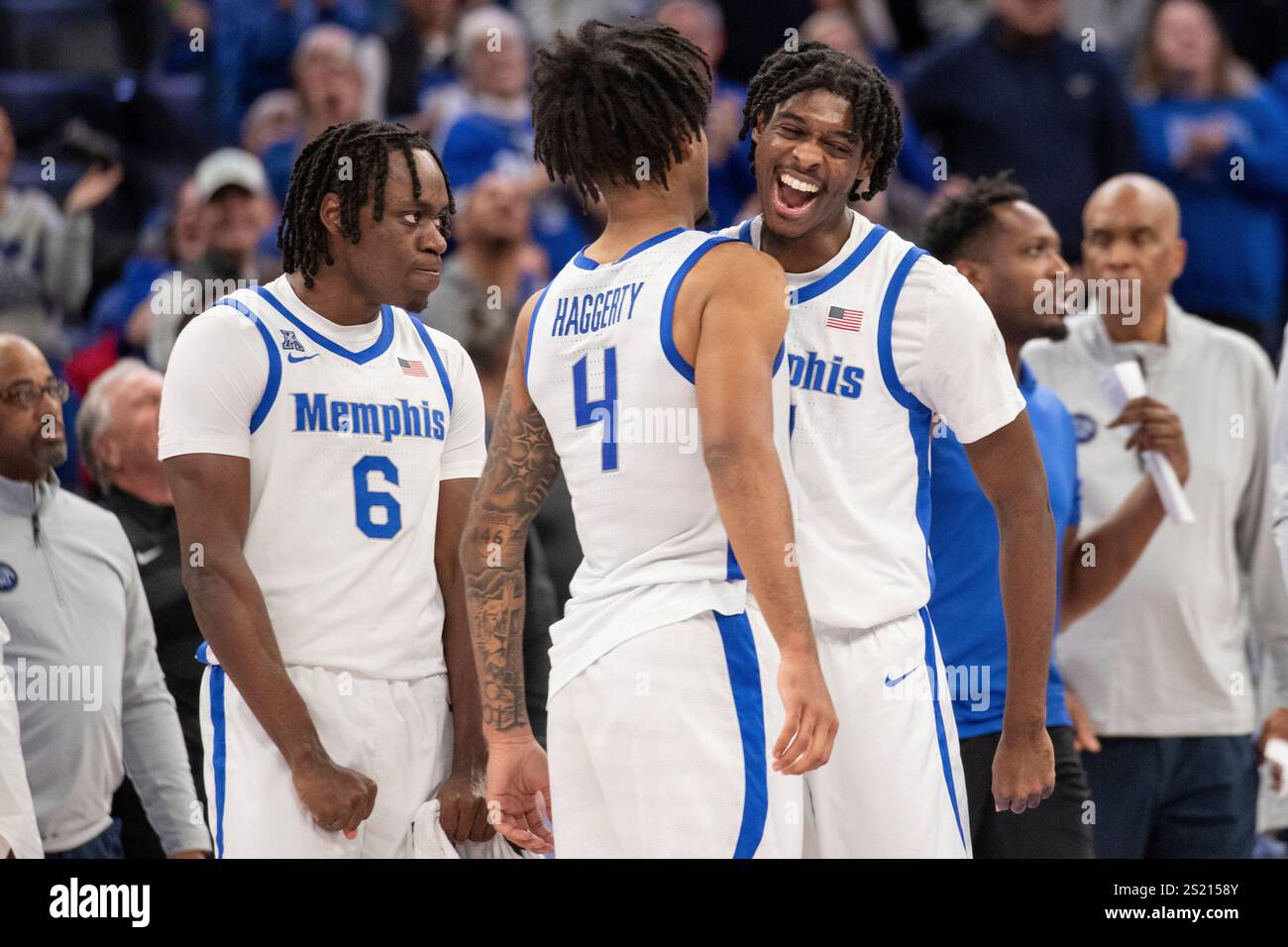 Memphis guards Baraka Okojie (6), PJ Haggerty (4) and PJ Carter, right ...