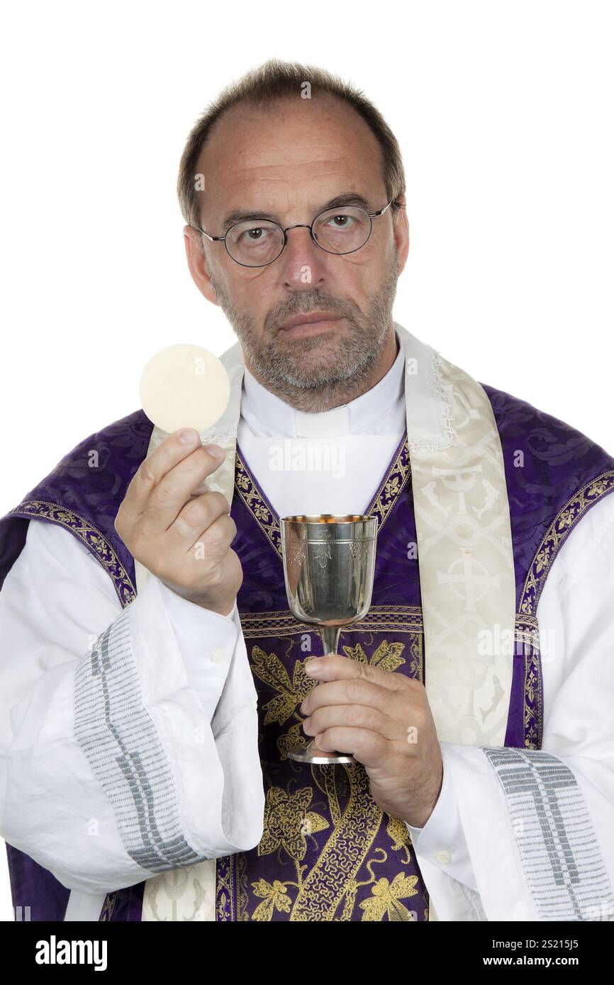 A Catholic priest with chalice and host at Communion Austria Stock ...