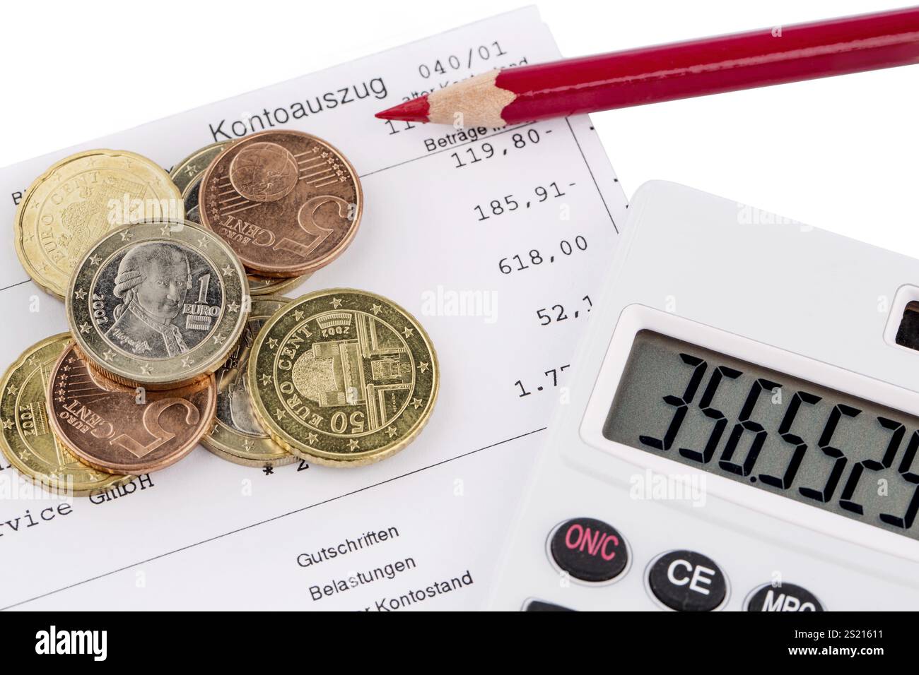 The bank statement of a bank and some coins of the euro currency ...