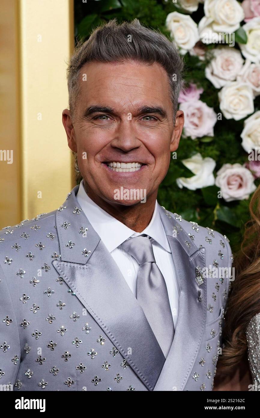 Robbie Williams arrives at the 82nd Golden Globes on Sunday, Jan. 5 ...