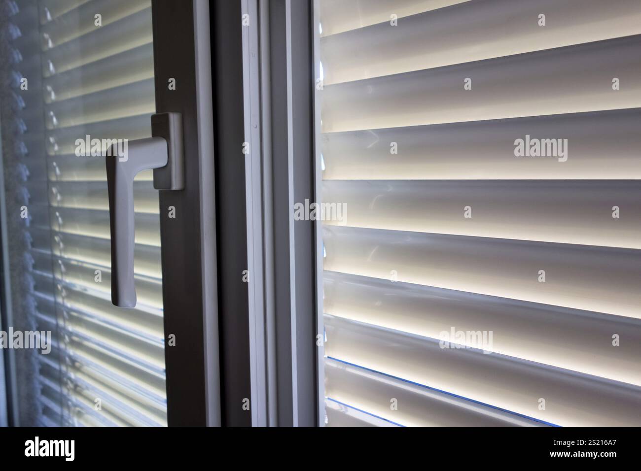 Blinds are fitted to a window to protect against heat and sun. Austria ...