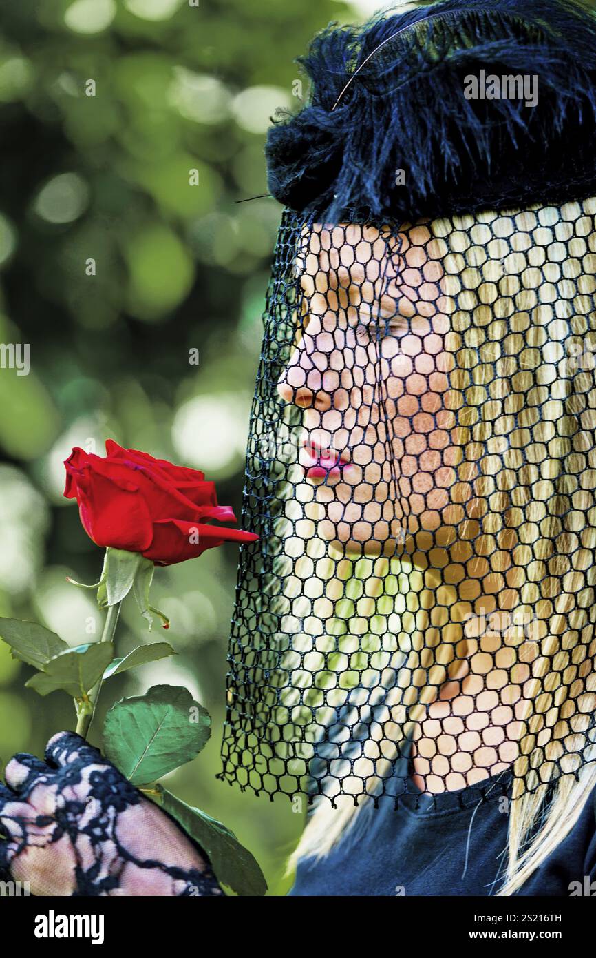 A young, grieving widow with a veil and rose. Death and inheritance ...