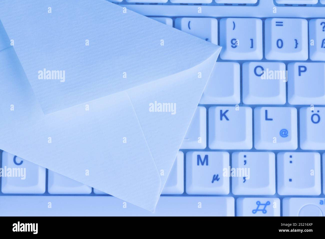 The keyboard of a computer and an envelope. Communication via e-mail ...