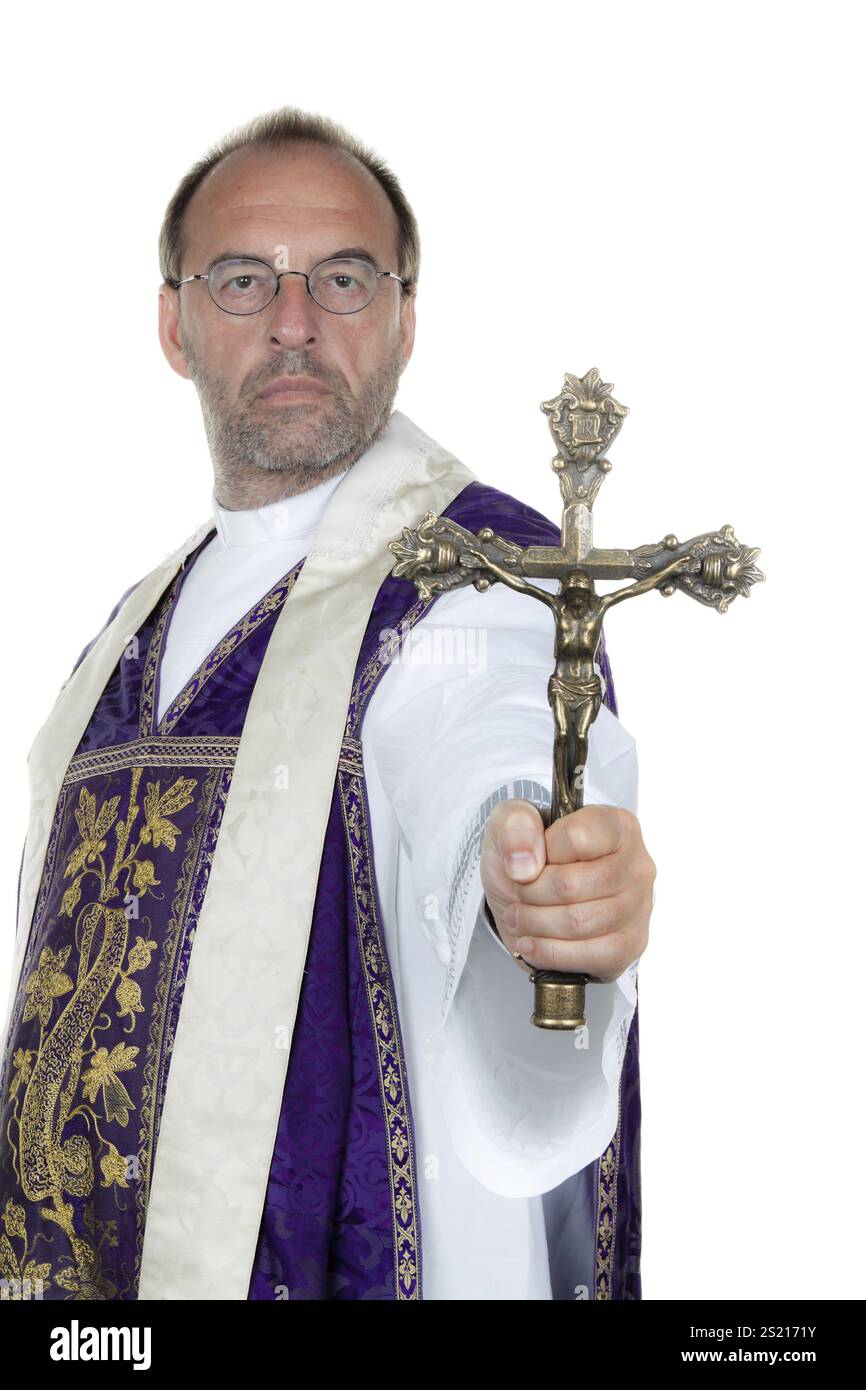 A Catholic priest with a cross in his hand Austria Stock Photo - Alamy