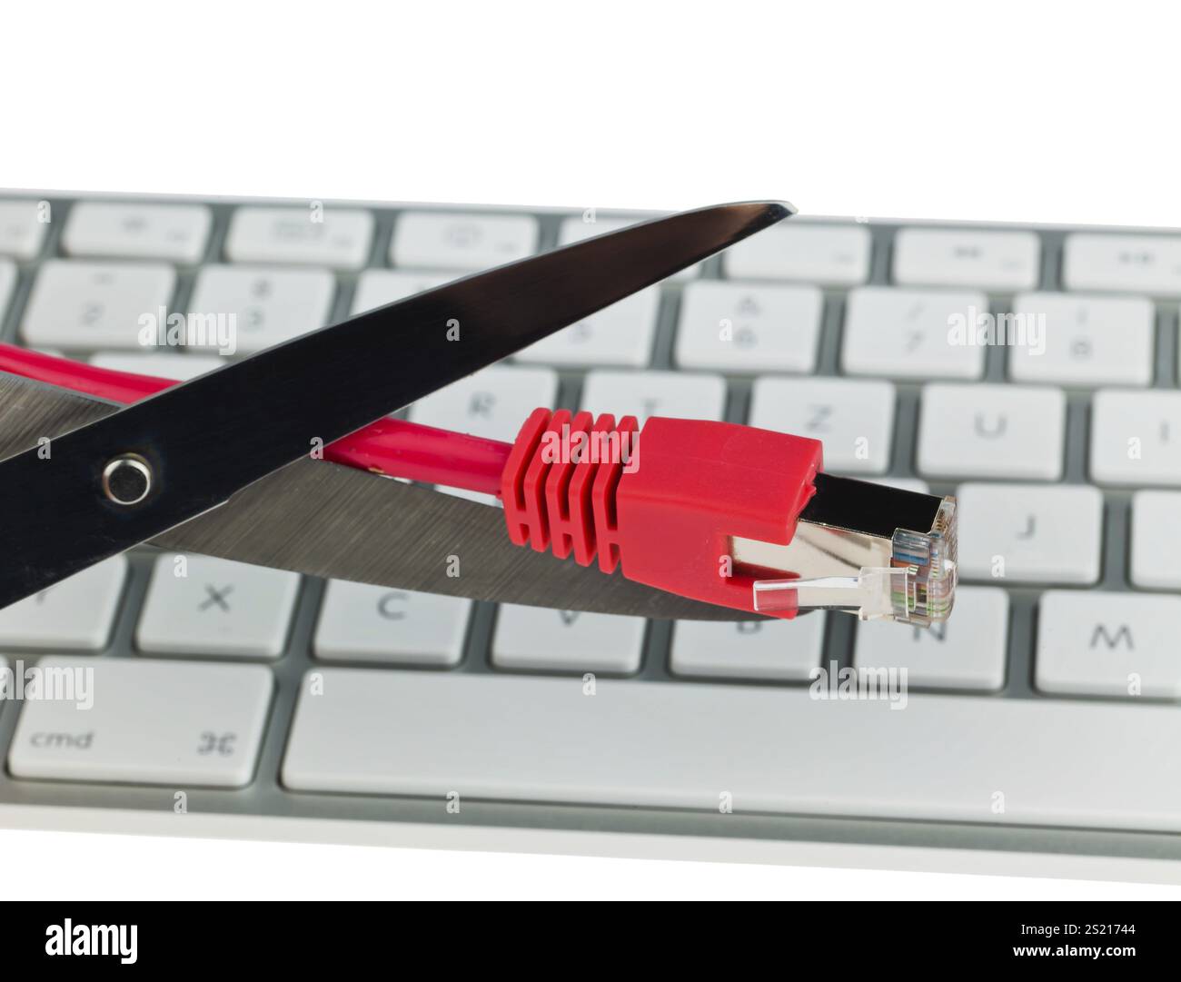 The red cable of a network from a computer. Disconnected with scissors ...