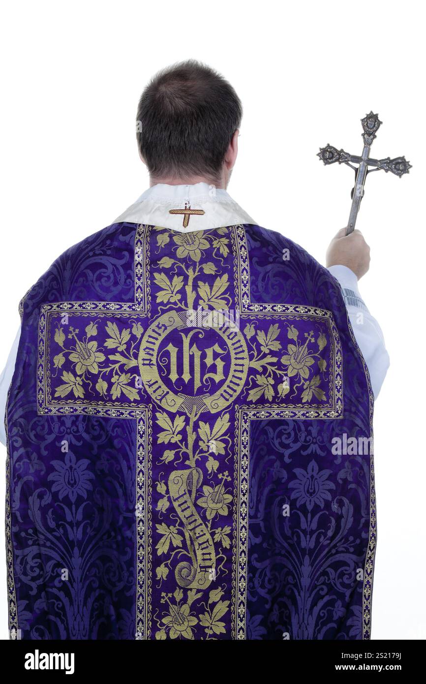 A catholic priest praying with a crucifix Austria Stock Photo - Alamy