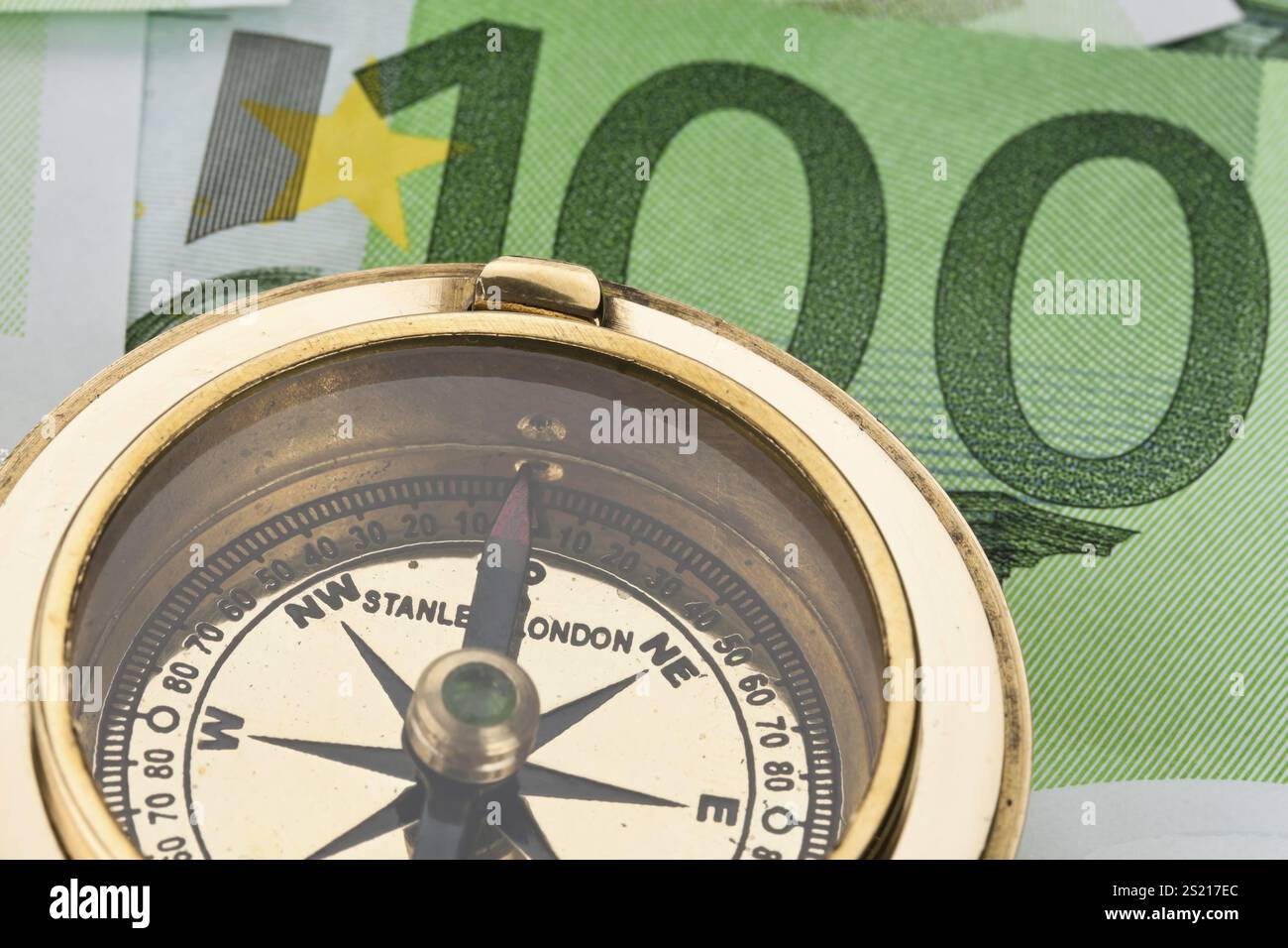 100 euro banknote with a compass. Close-up Austria Stock Photo - Alamy