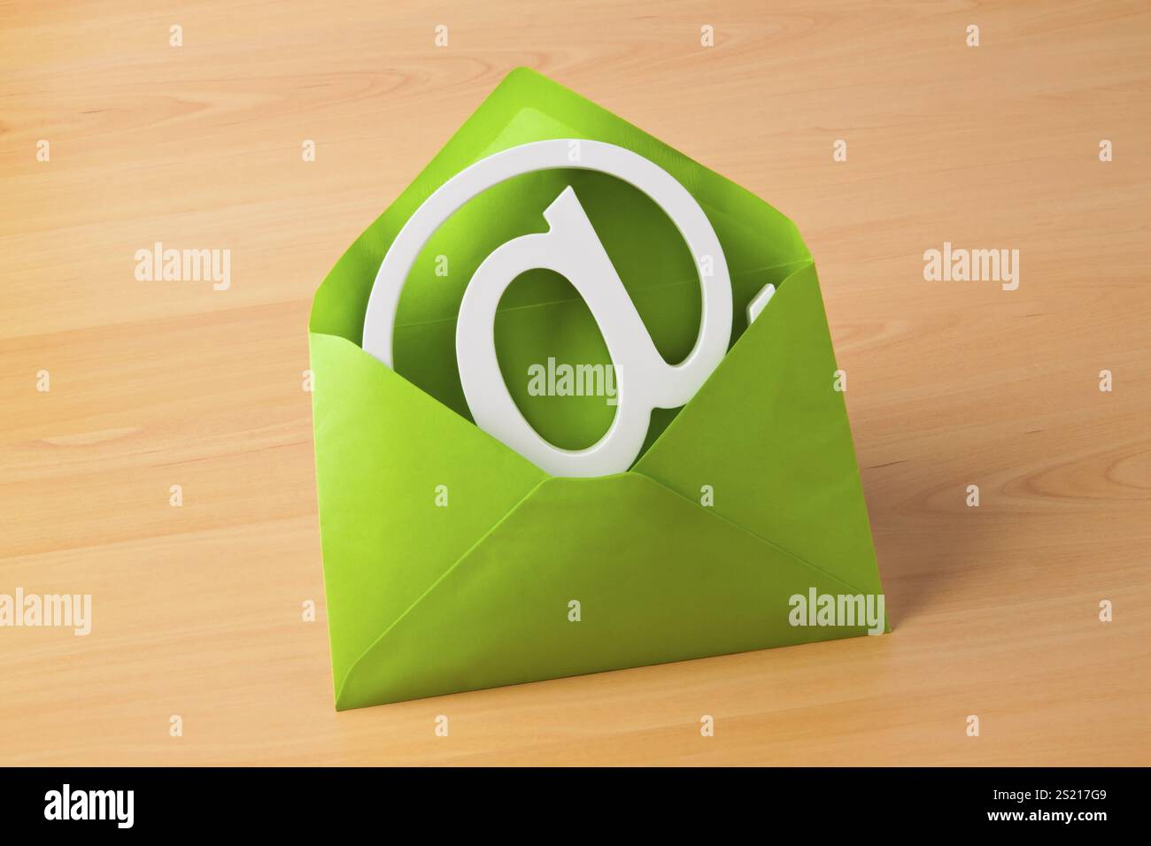 The e-mail logo in a green envelope Stock Photo - Alamy