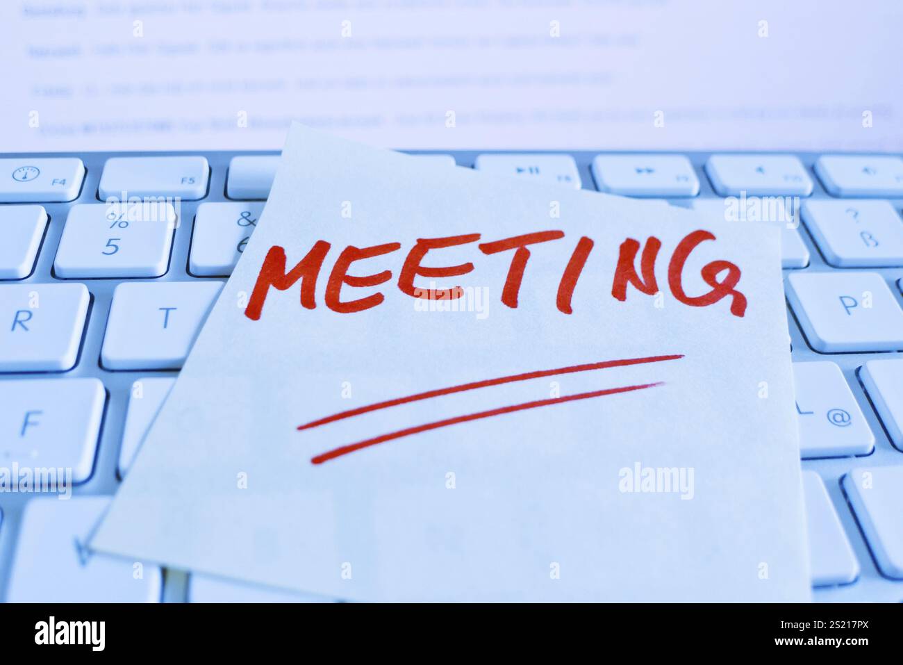 A note on the keyboard of a computer as a reminder: Meeting Austria ...