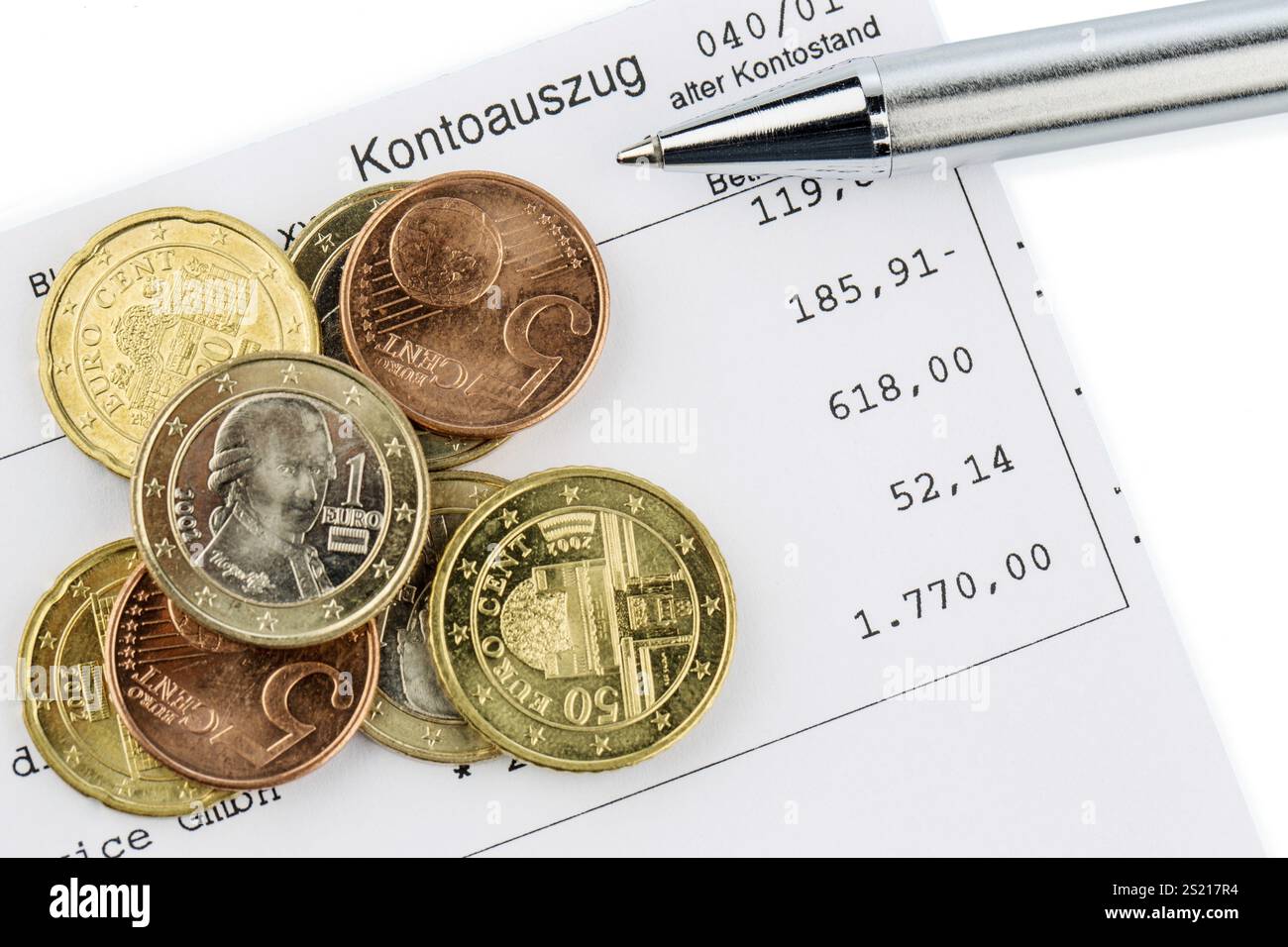 The bank statement of a bank and some coins of the euro currency ...