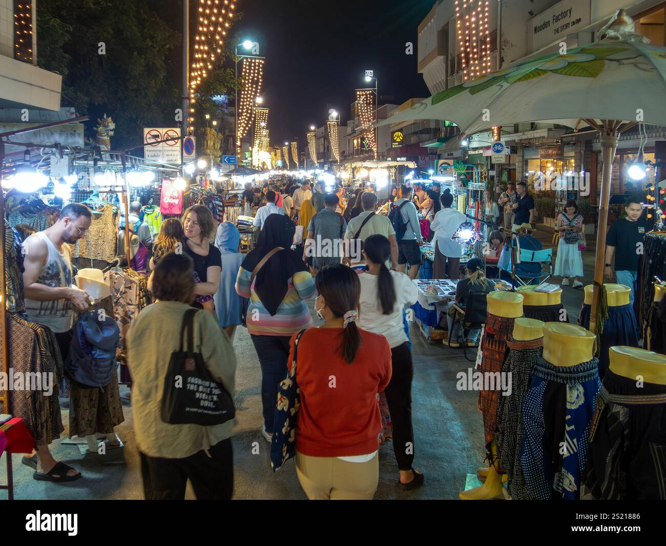 Chiang Mai, Thailand. 05th Jan, 2025. Tourists walk along Tha Phae Road ...