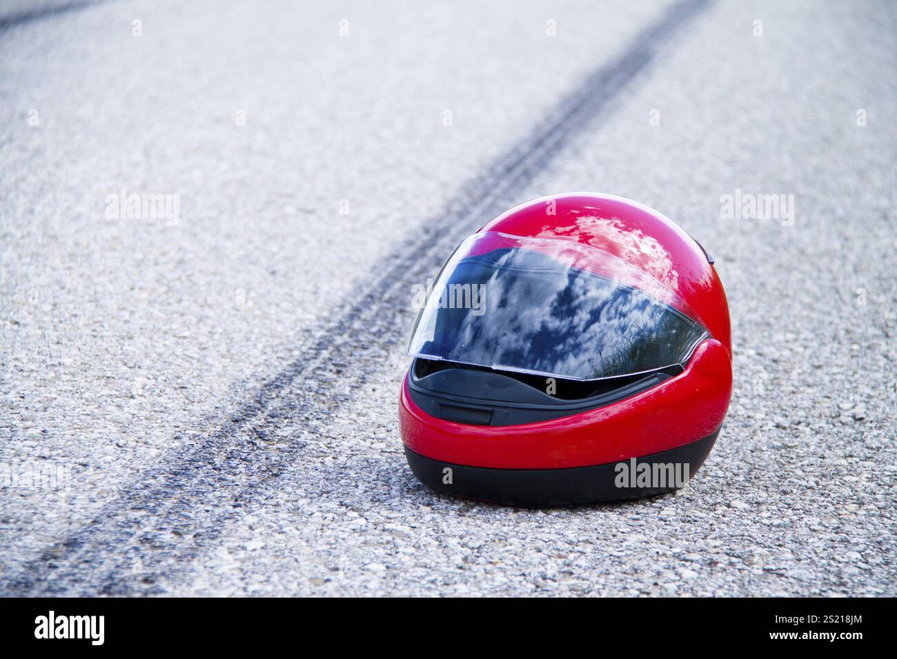 An accident with a motorbike. Traffic accident and skid marks on road ...