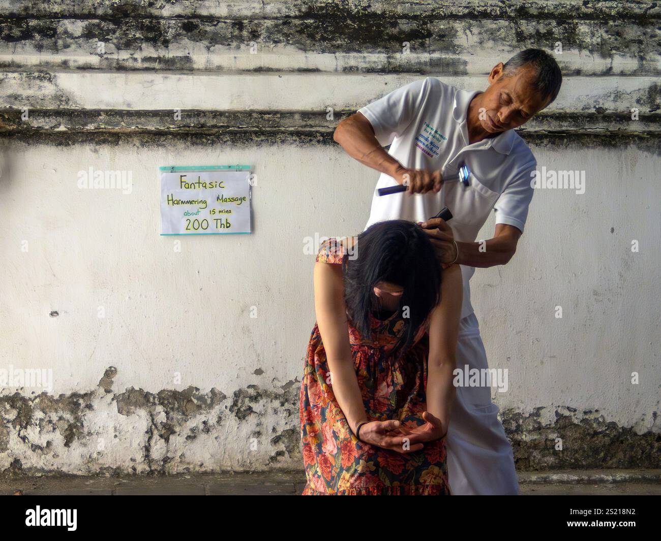 Chiang Mai, Thailand. 05th Jan, 2025. A tourist receives a traditional ...