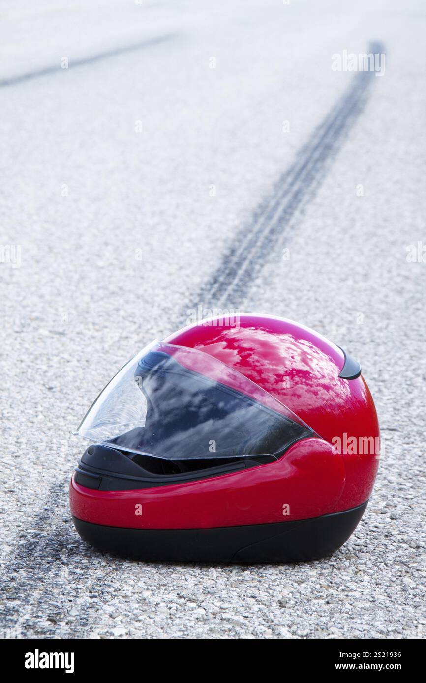 An accident with a motorbike. Traffic accident and skid marks on road ...