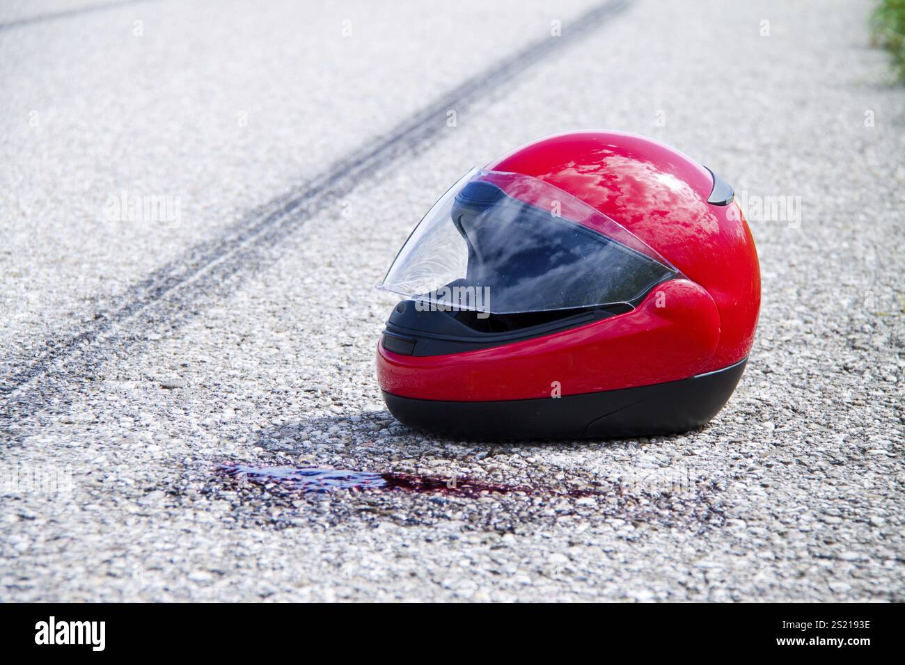 An accident with a motorbike. Traffic accident and skid marks on road ...