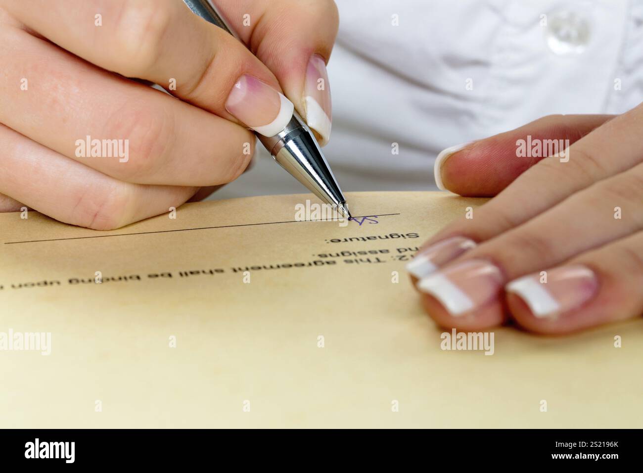 Hand with fountain pen signs contract. Woman signing Austria Stock ...