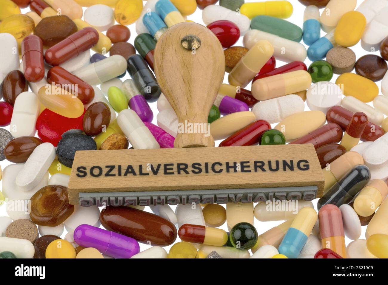 Stamp on colourful tablets, symbol for social insurance, medication and ...