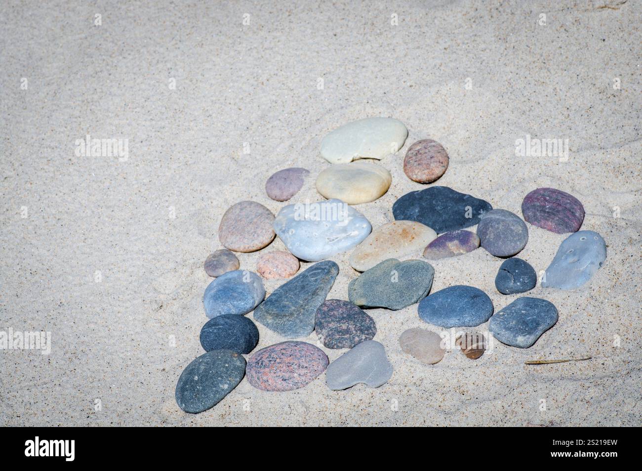 Round pebbles on the beach in Denmark is a symbol for balance. Stones ...