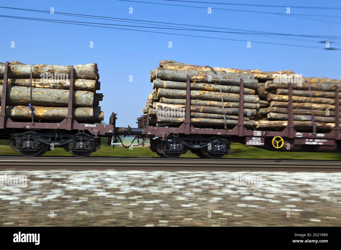 The wagons of a goods train on railway tracks. Environmentally friendly ...