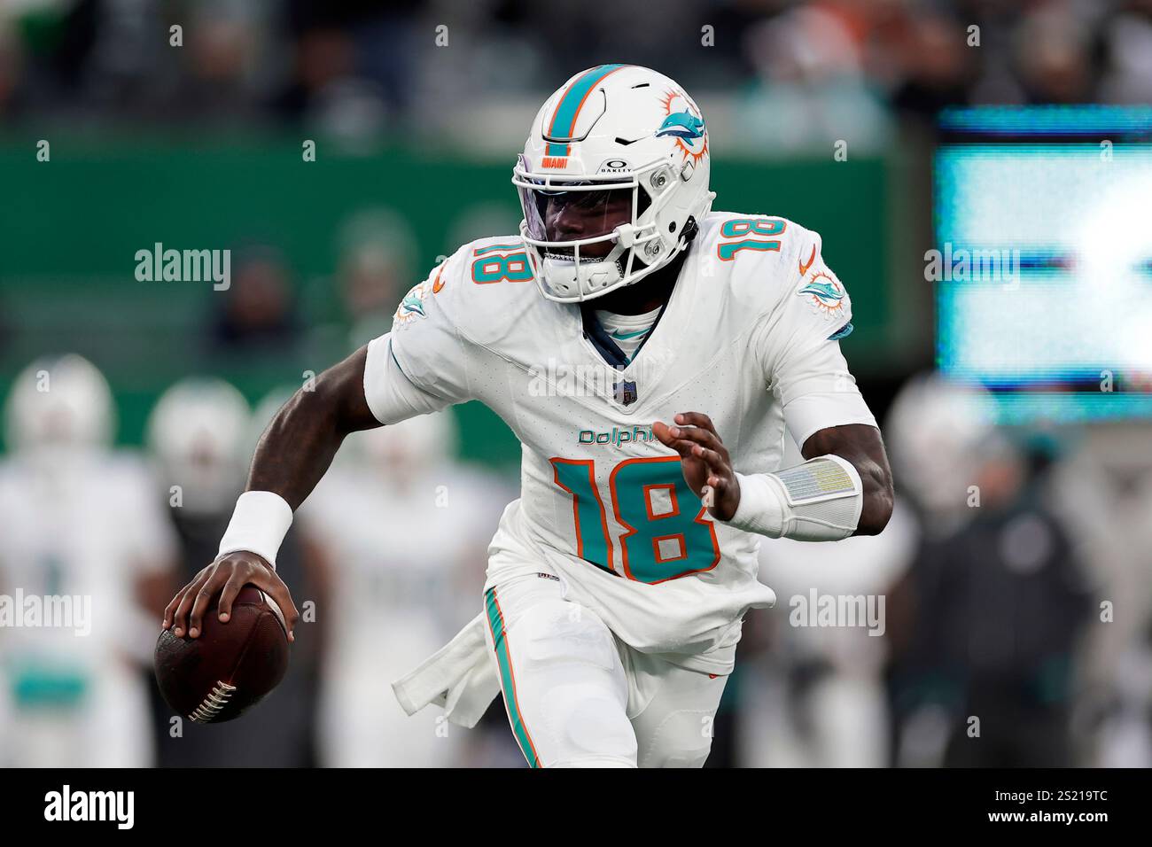 Miami Dolphins quarterback Tyler Huntley (18) looks to pass the ball ...