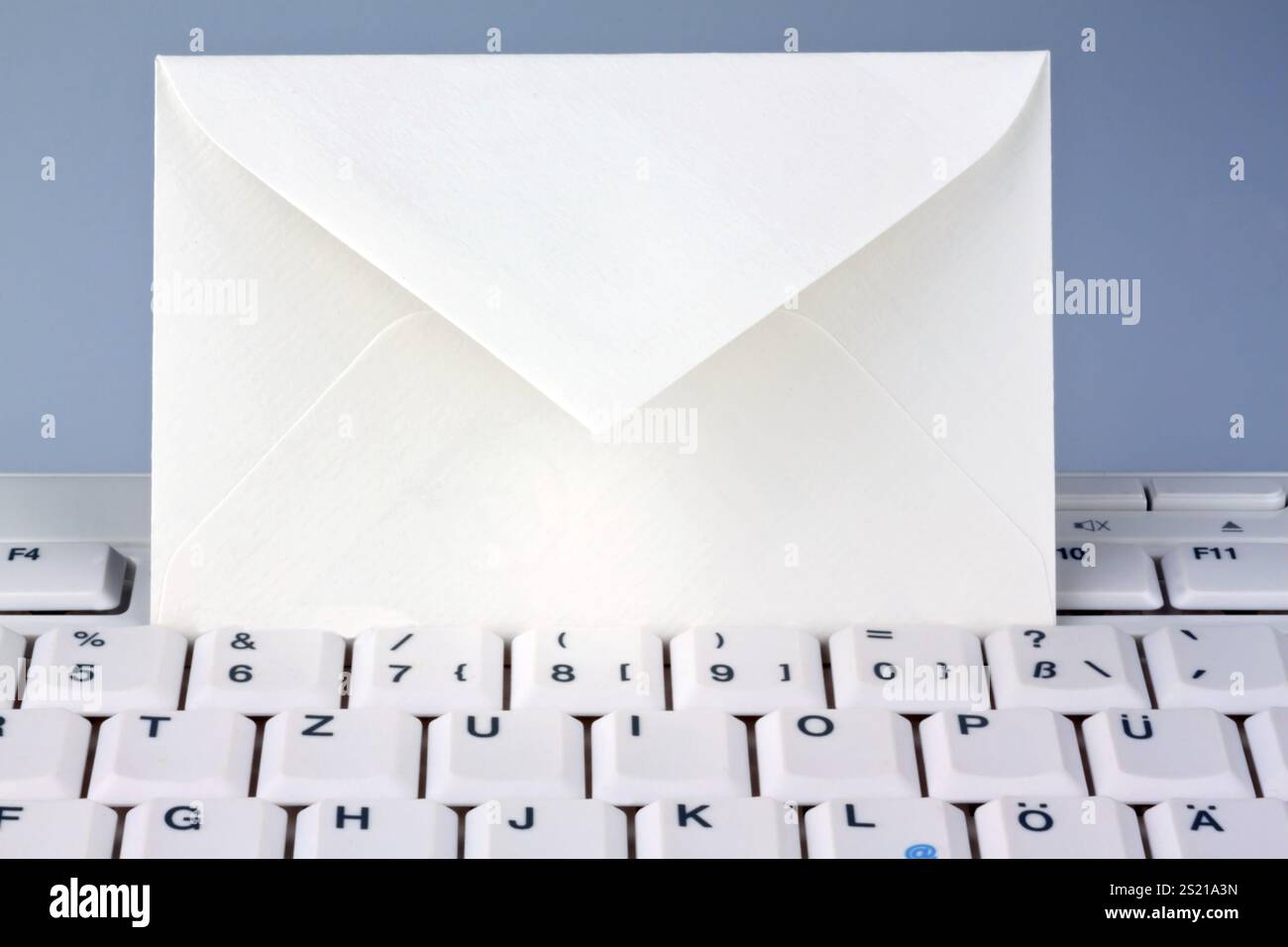 The keyboard of a computer and an envelope. Communication via e-mail ...