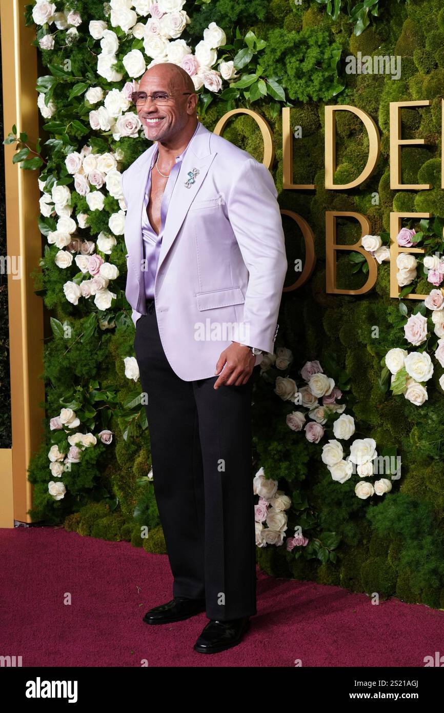 Dwayne Johnson arrives at the 82nd Golden Globes on Sunday, Jan. 5 ...